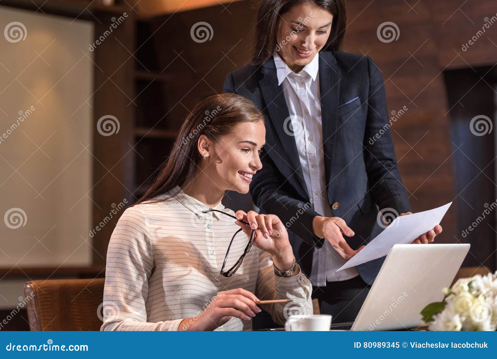 Delighted Female Colleagues Working Together in Office Stock Image ...