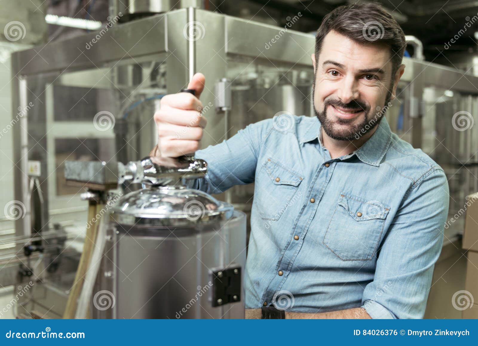 Delighted Man Pouring Alcohol in Brewery Stock Photo - Image of brewing ...