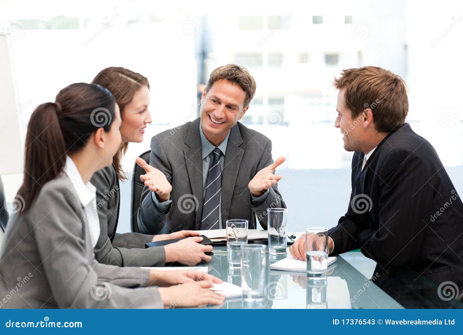 Delighted Manager Talking To His Team at a Table Stock Image - Image of ...