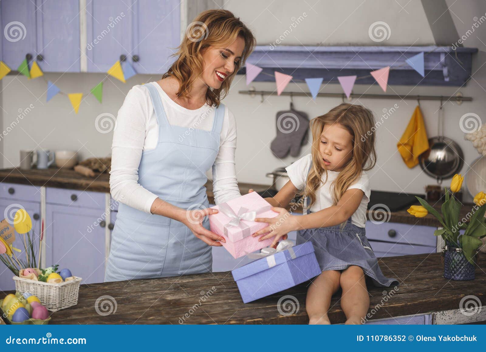 Delighted Mom Congratulating Daughter with Easter Stock Photo - Image ...