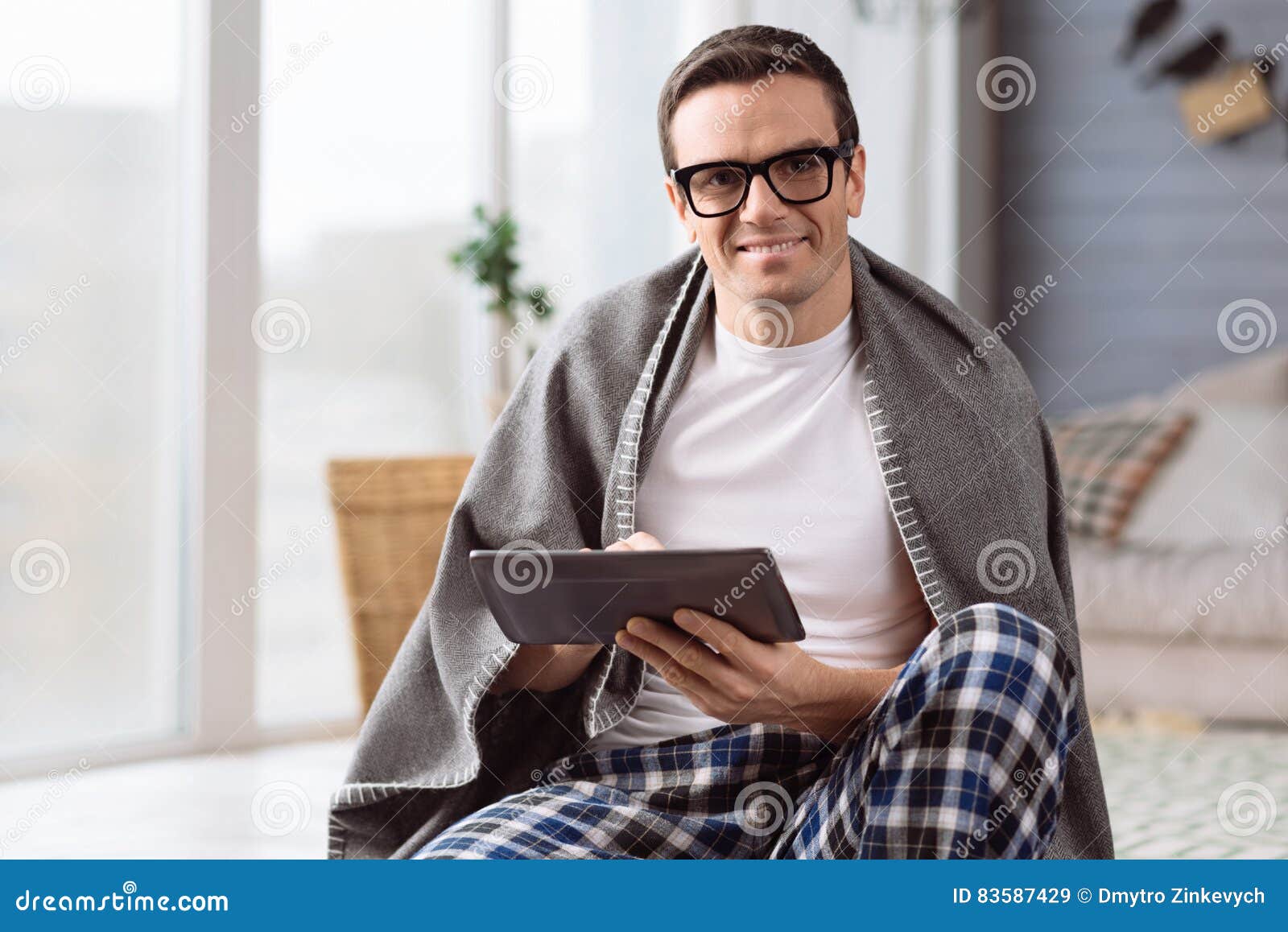 Delighted Nice Man Holding a Tablet Stock Image - Image of inside ...