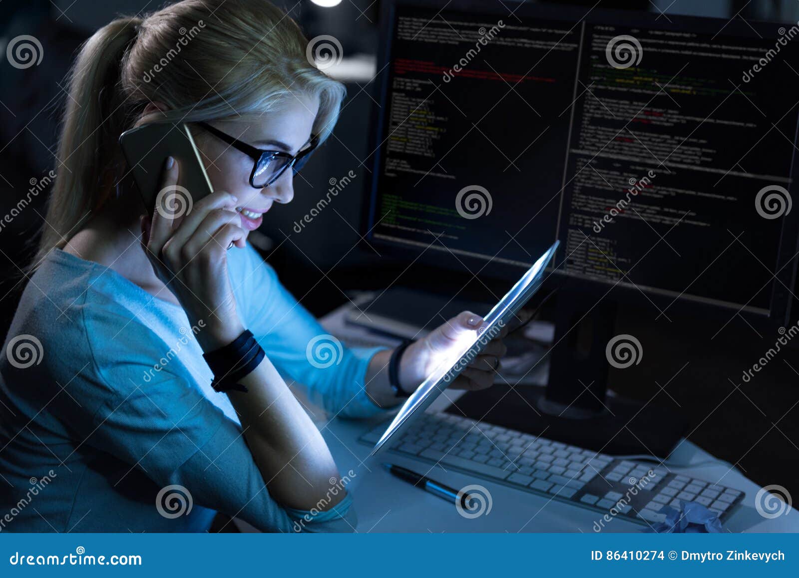 Delighted Receptionist Working in the Dark Lighted Placement Stock ...