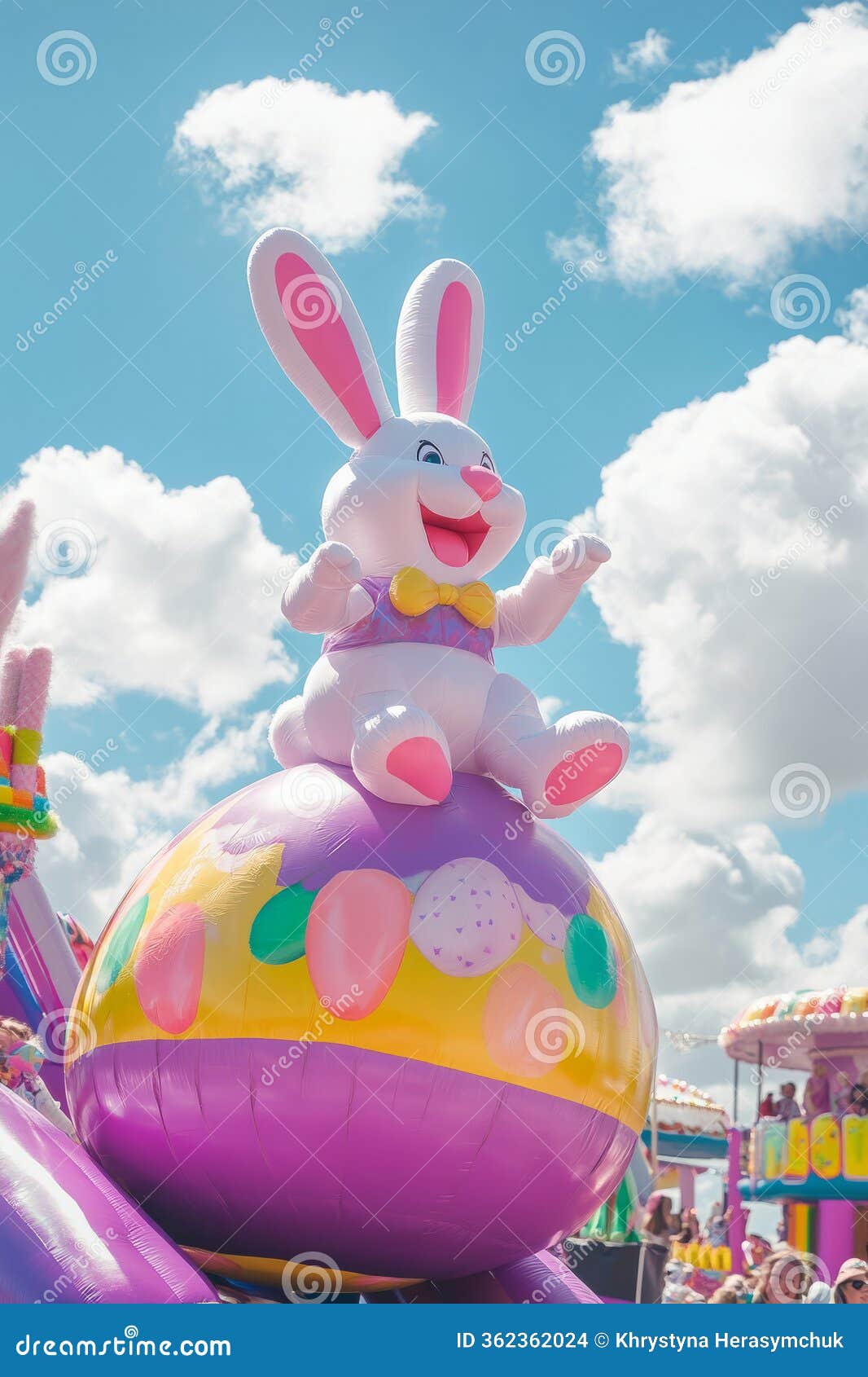 A Delightful Easter Bunny Bouncing on a Giant Inflatable Easter Egg in a Fun-filled Carnival ...