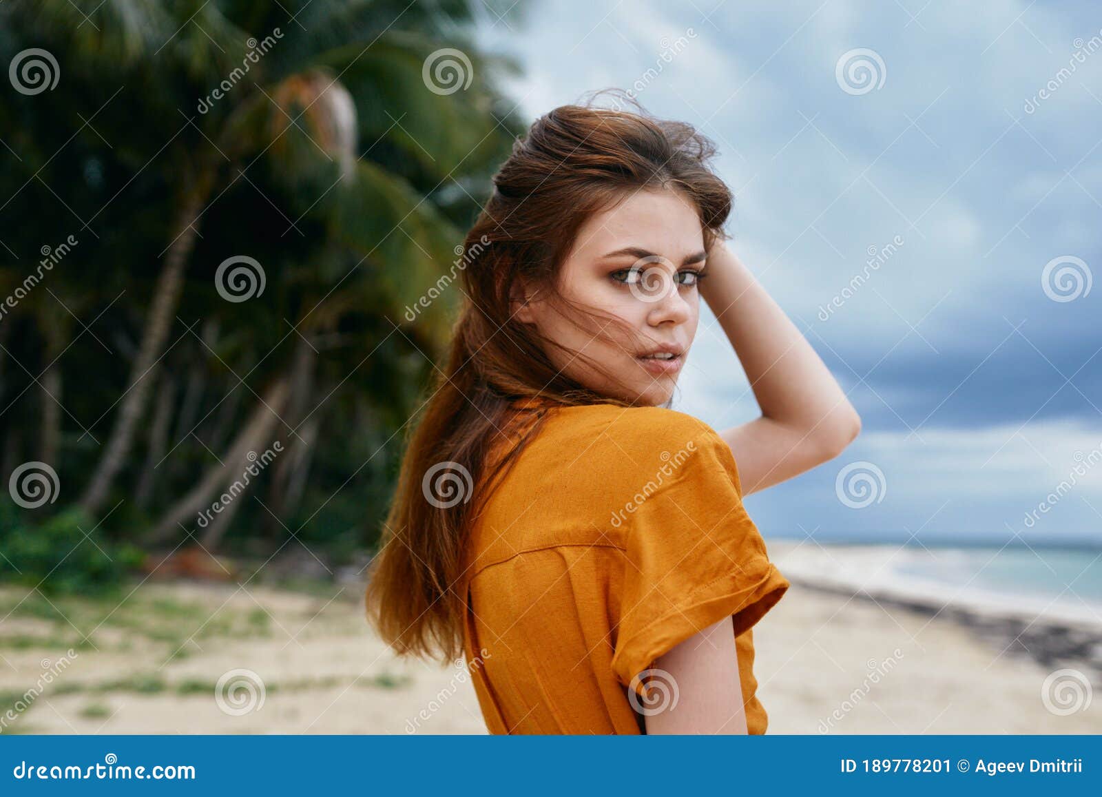 A Delightful Woman Looking at the Camera and Exotic Island Stock Image ...