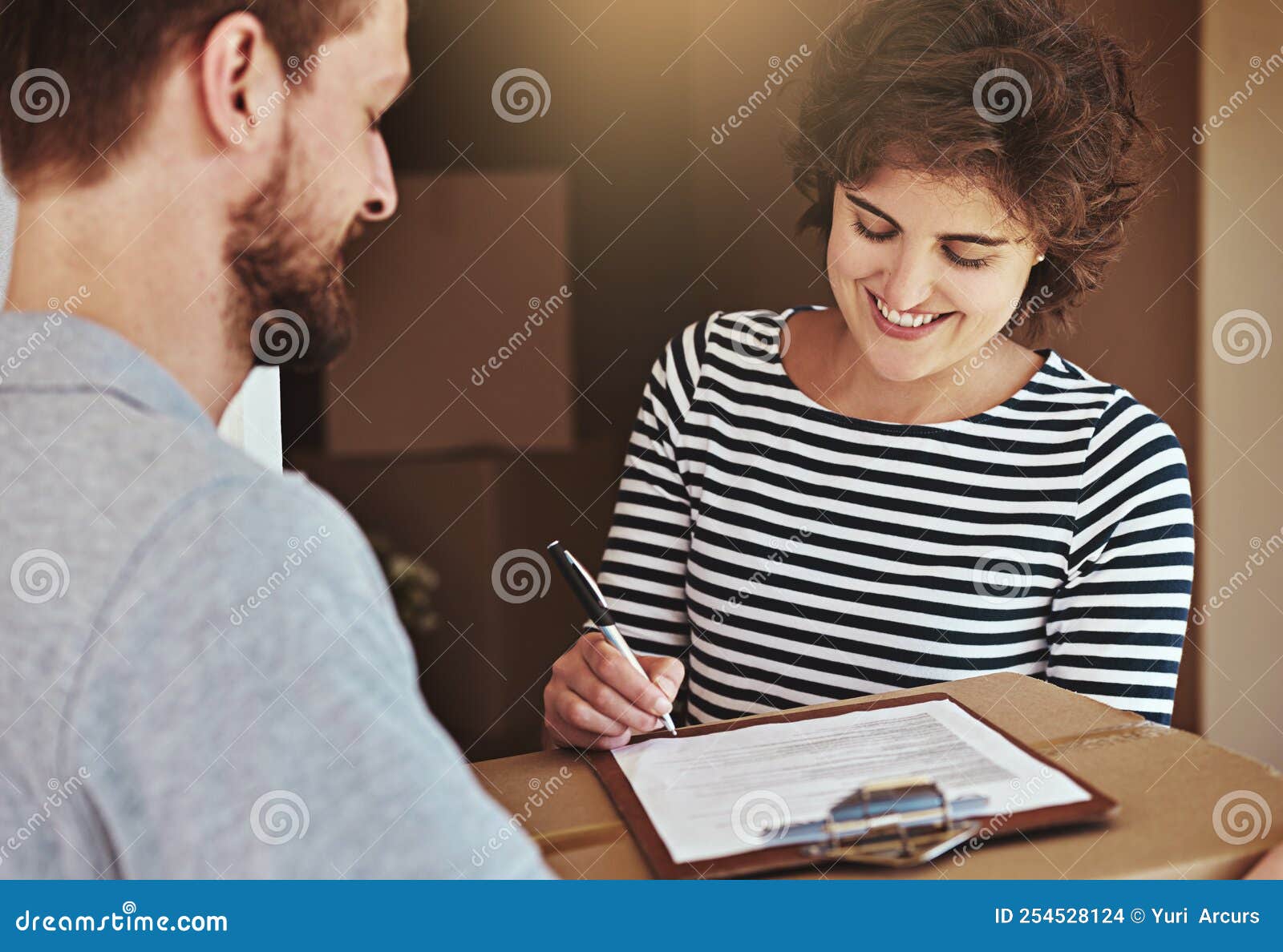 Delivered on the Same Day. a Delivery Man Making a Delivery To a ...