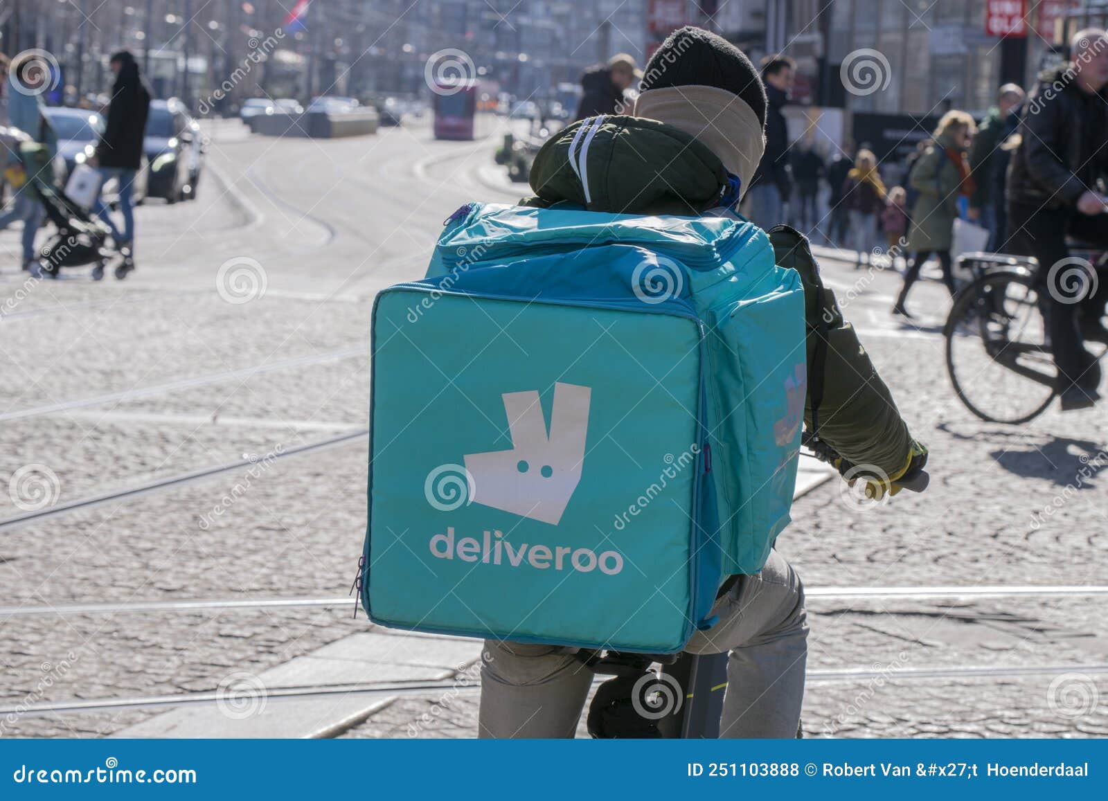 Deliveroo Delivery Person On A Bicycle Delivering A Takeaway Food Order ...