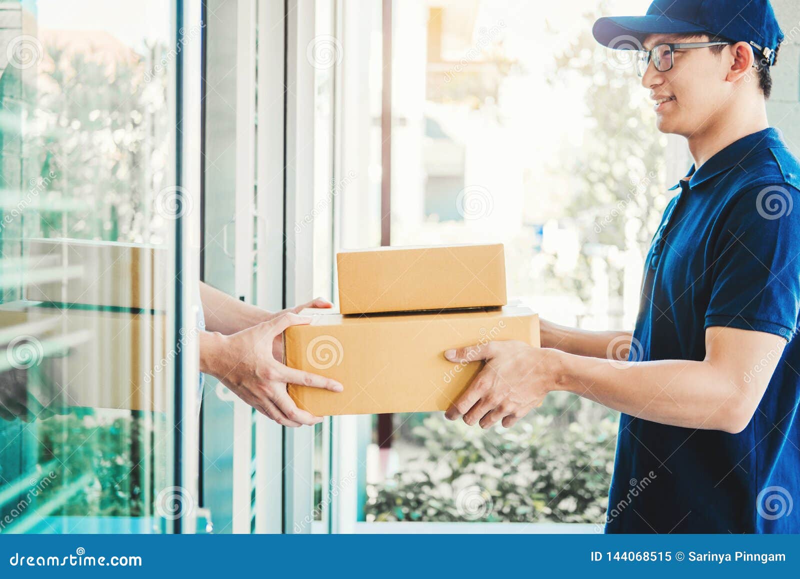 Delivery Asian Man Service with Boxes in Hands Standing in Front of ...