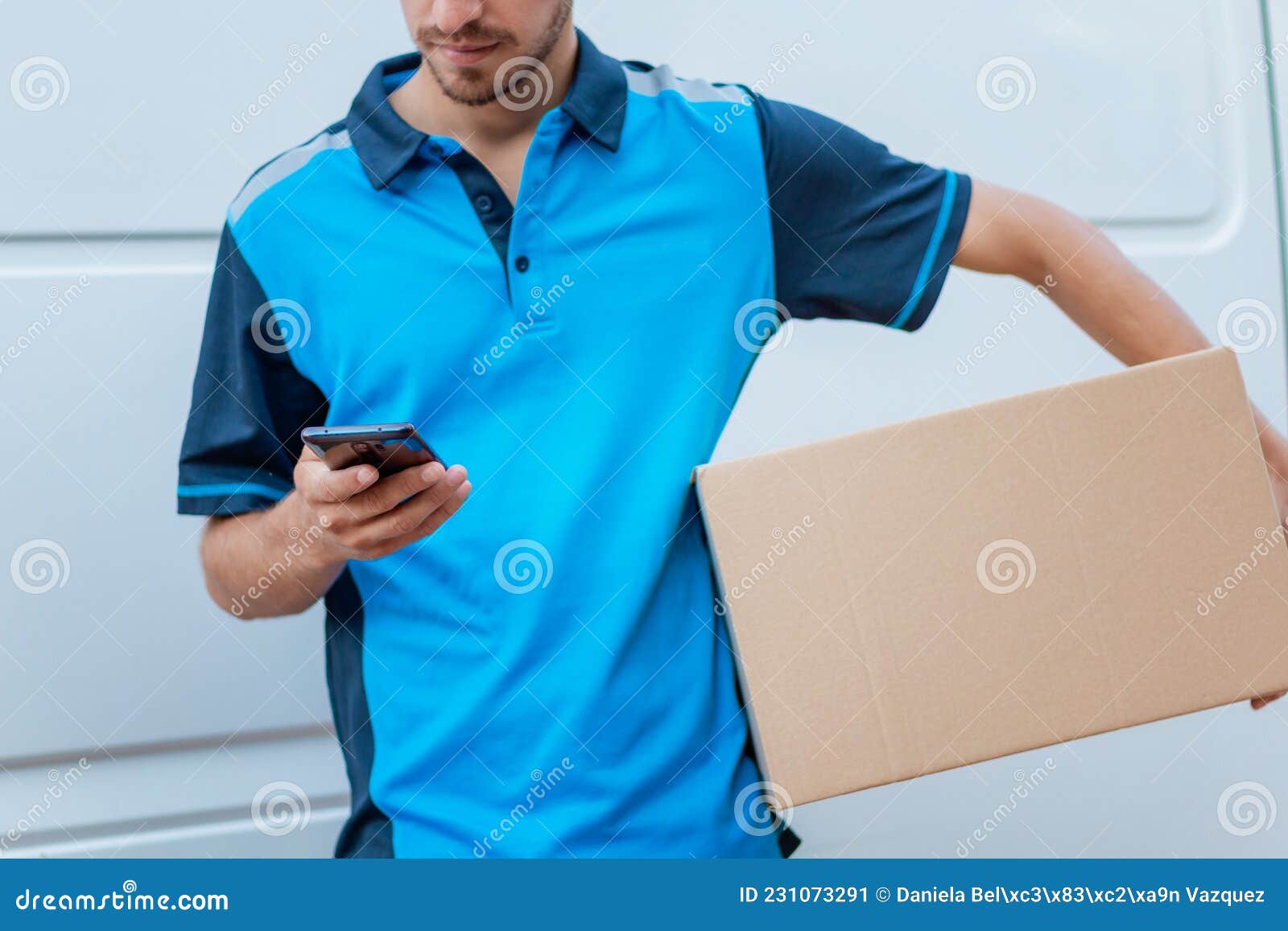 Delivery Boy Using the Phone Stock Image - Image of courier, satisfied ...