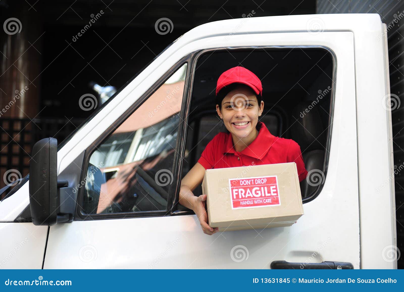 Delivery Courier In Truck Handing Over Package Stock Image - Image of ...