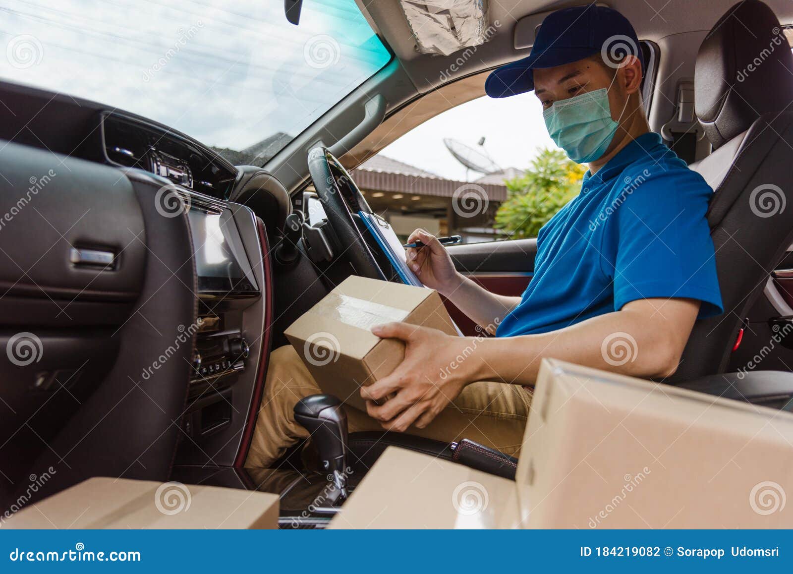Delivery Courier Young Man Driver Inside the Van Car with Parcel Post ...