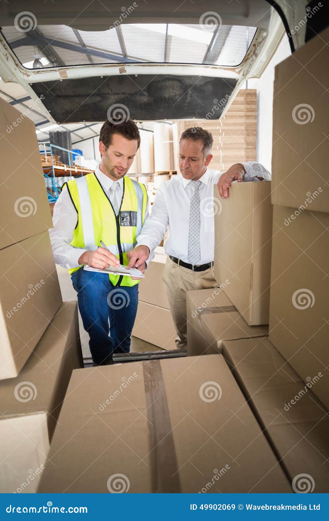 Delivery Driver Checking His List on Clipboard Stock Image - Image of ...