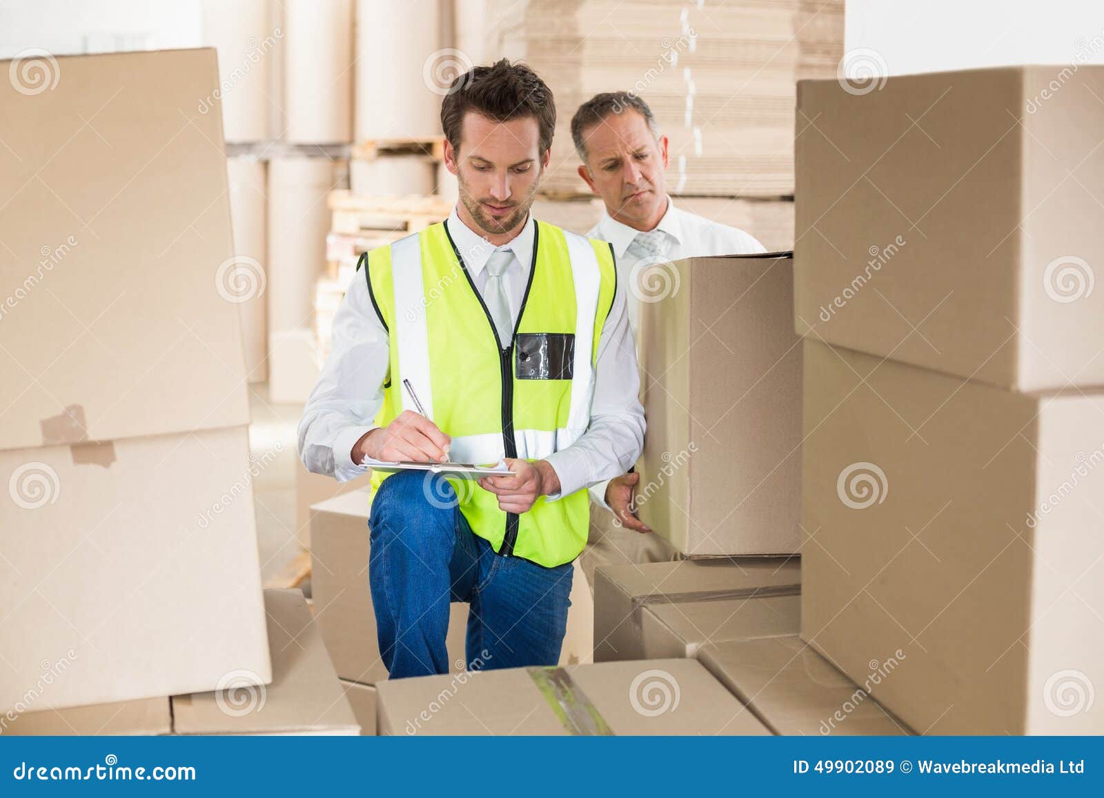 Delivery Driver Checking His List on Clipboard Stock Image - Image of ...