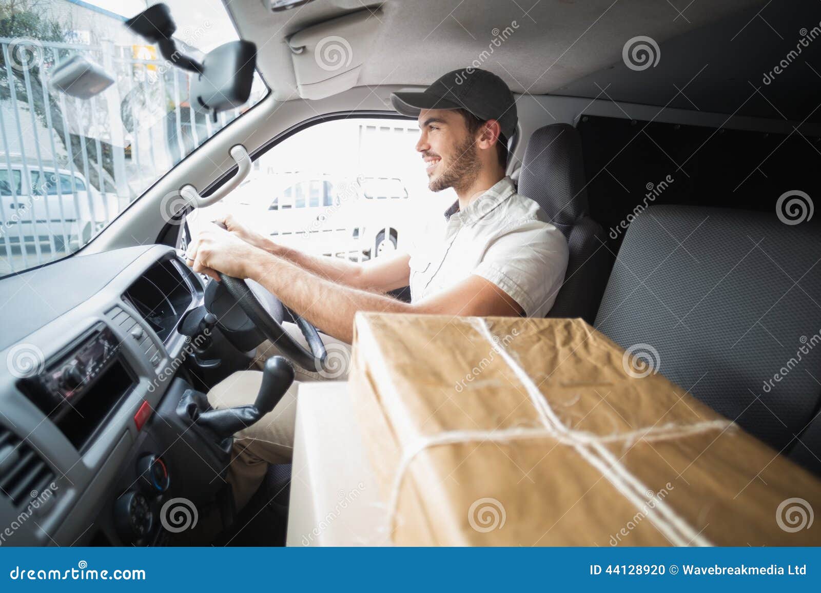 Delivery Driver Driving Van with Parcels on Seat Stock Photo - Image of ...