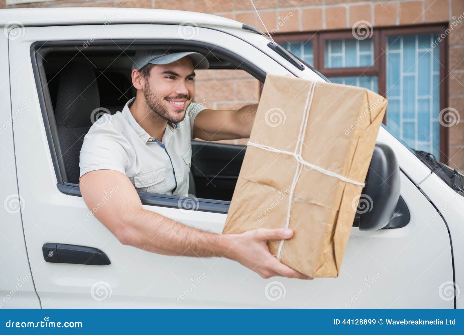 Delivery Driver Offering Parcel from His Van Stock Image - Image of ...