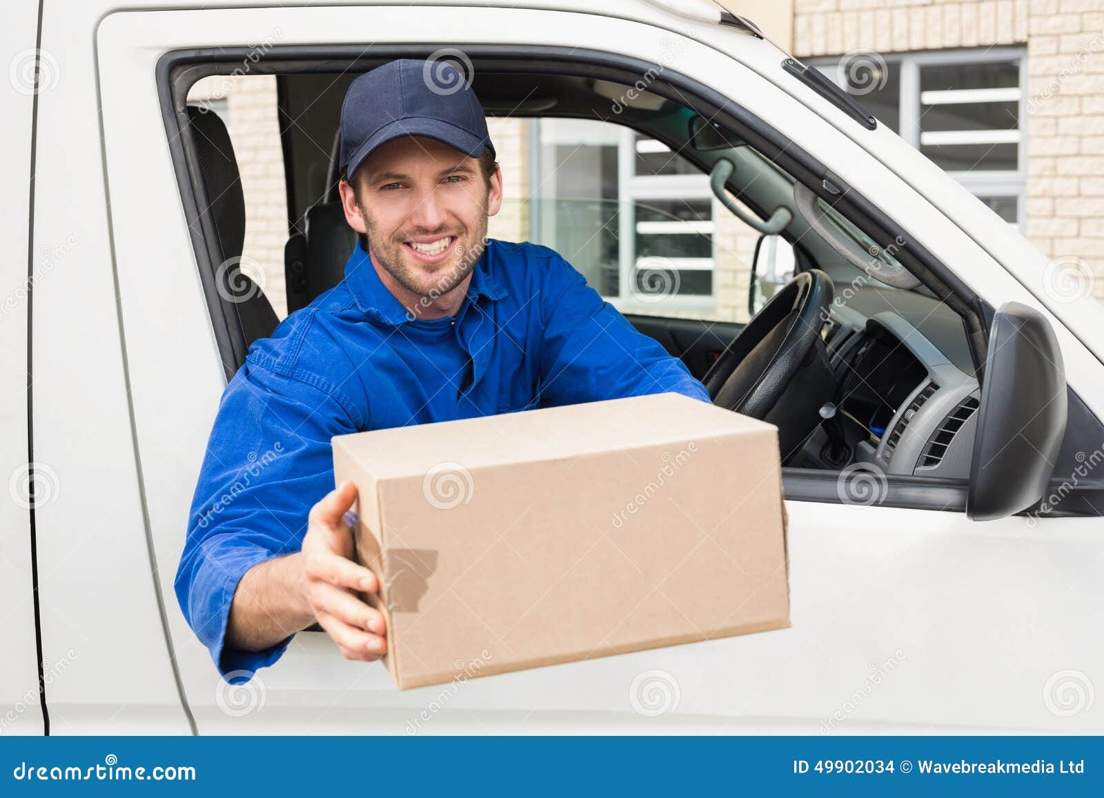 Delivery Driver Offering Parcel from His Van Stock Photo - Image of ...