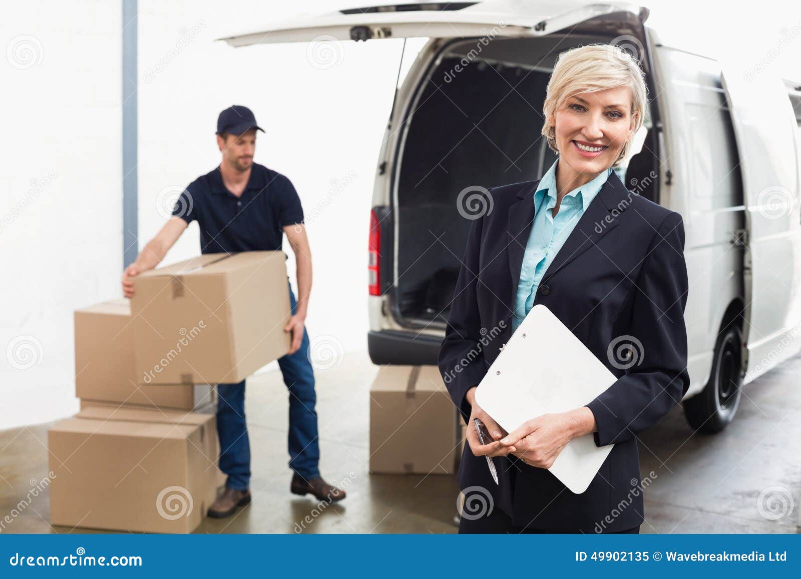 Delivery Driver Packing His Van with Manager Smiling Stock Image ...