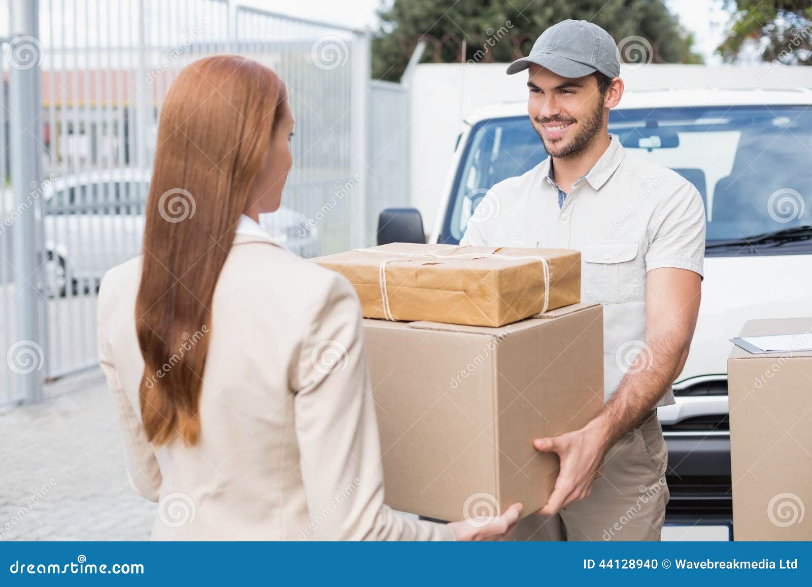 Delivery Driver Passing Parcels To Happy Customer Stock Photo - Image ...