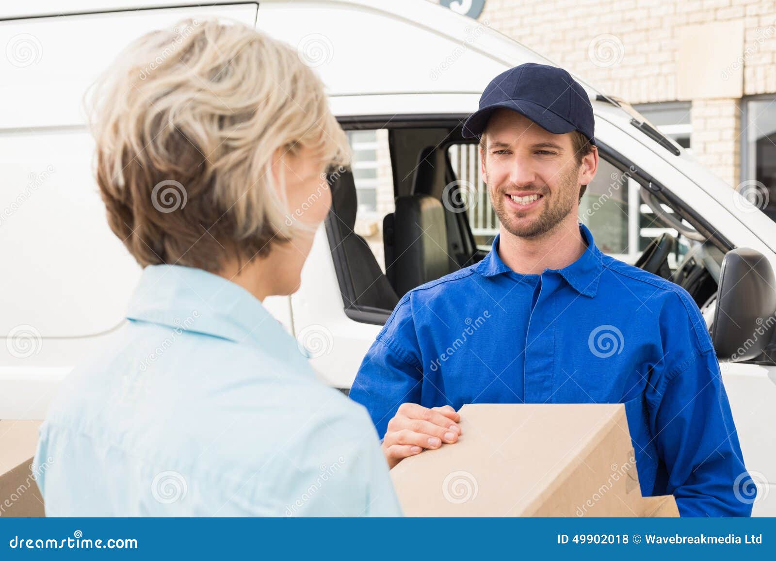 Delivery Driver Passing Parcels To Happy Customer Stock Photo - Image ...