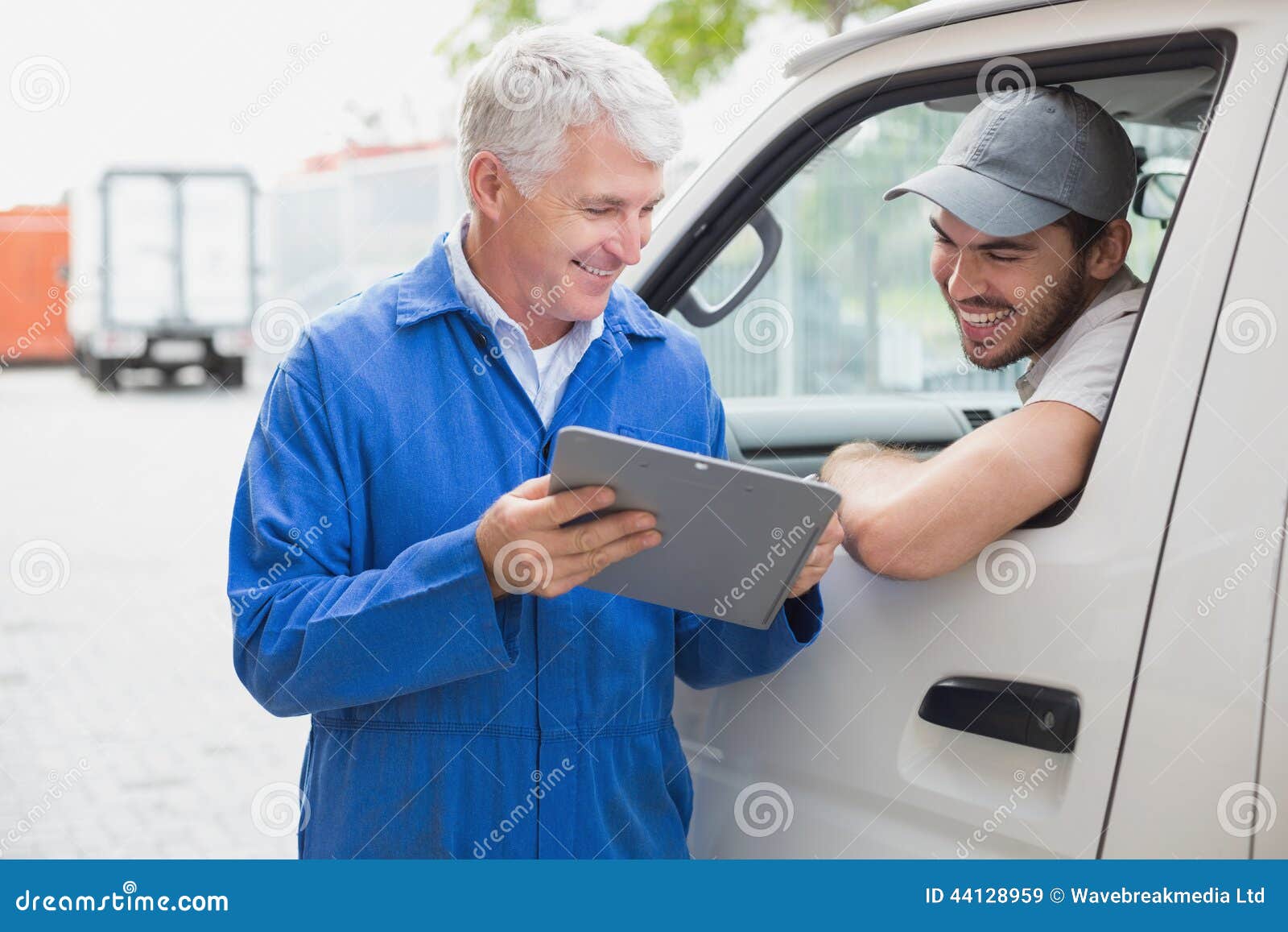 Delivery Driver Smiling at Camera with Customer Stock Image - Image of ...