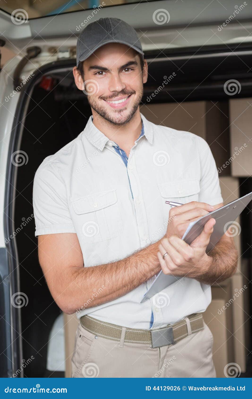 Delivery Driver Smiling at Camera beside His Van Stock Photo - Image of ...
