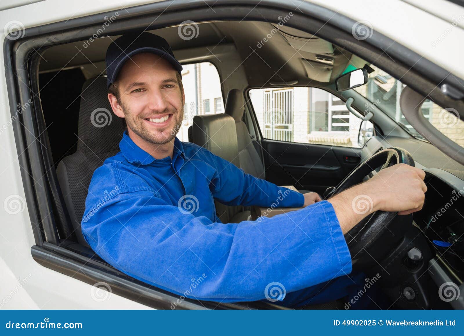 Delivery Driver Smiling at Camera in His Van Stock Image - Image of ...