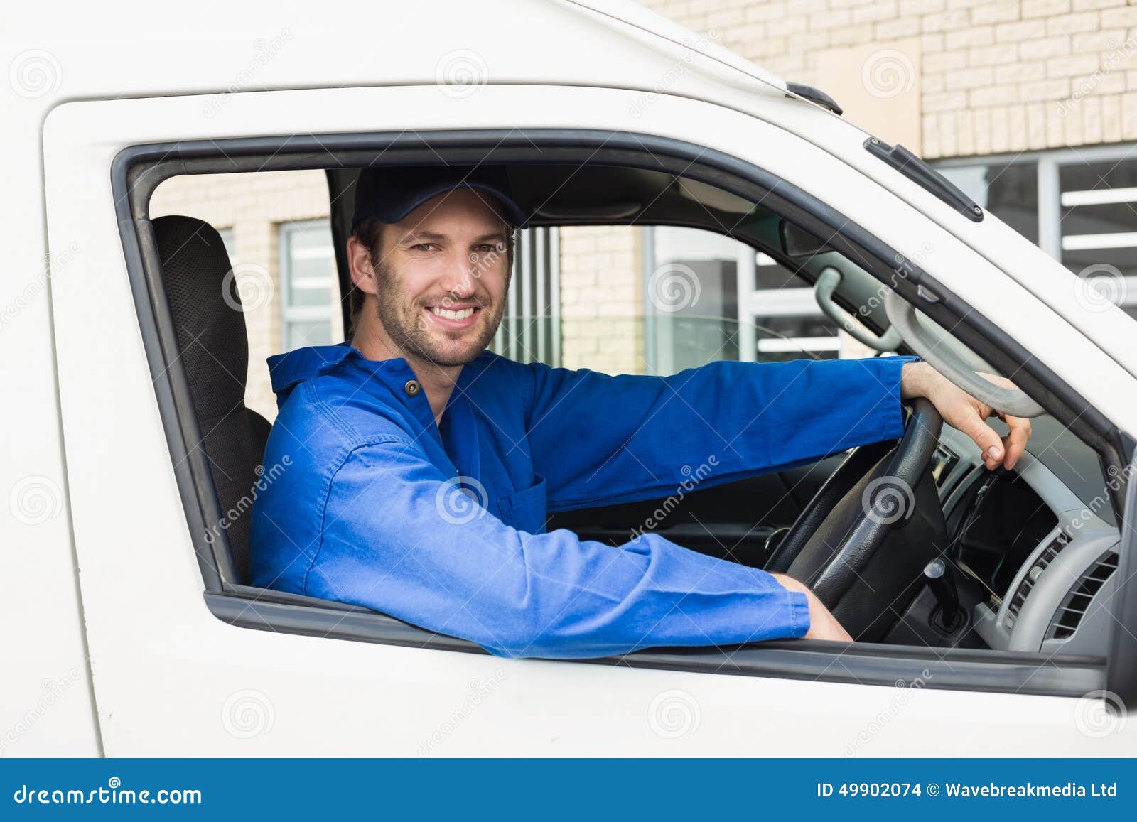 Delivery Driver Smiling at Camera in His Van Stock Photo - Image of ...
