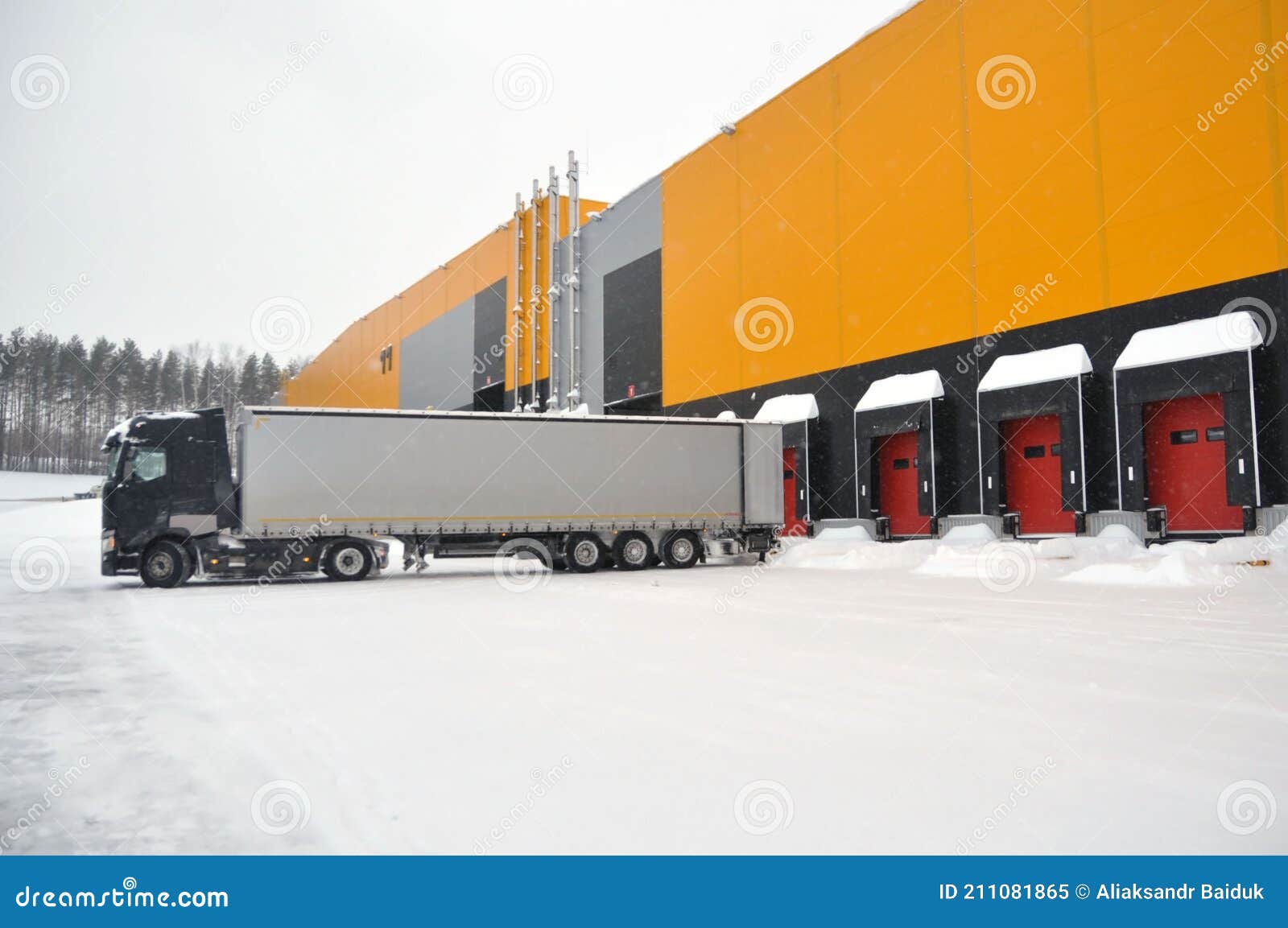Delivery of Goods by Truck To a Warehouse Complex in Winter Editorial ...