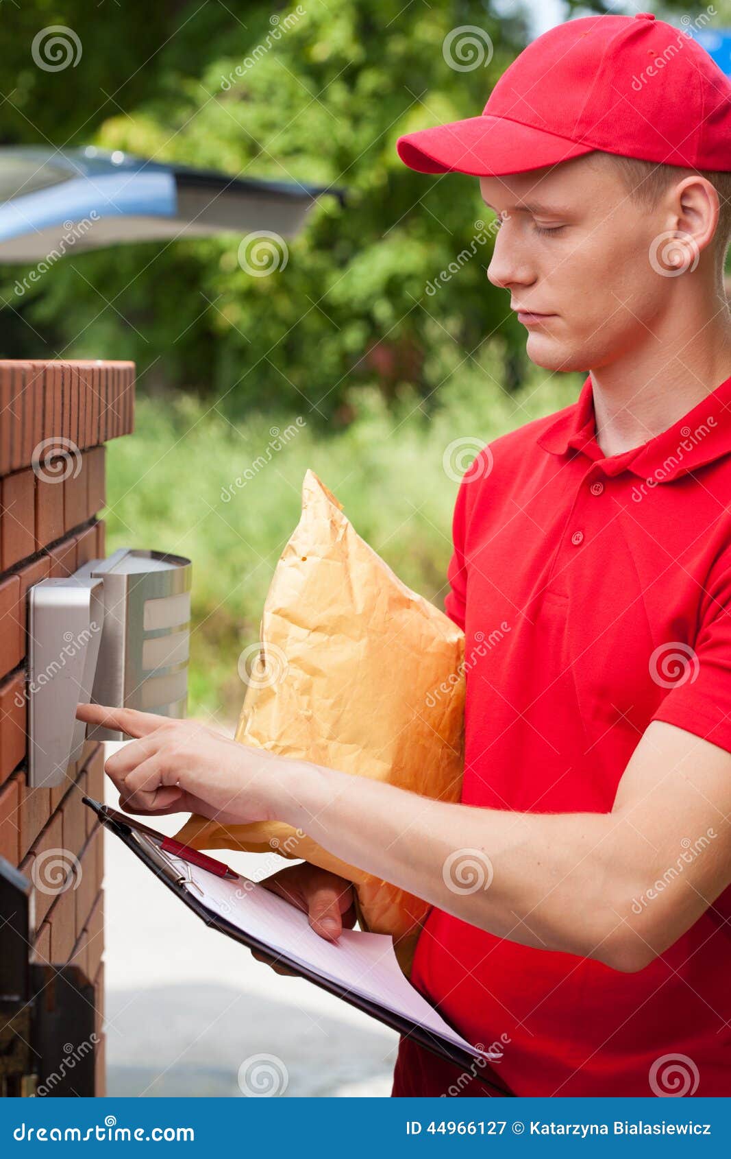 Delivery Guy Calling on Entryphone Stock Image - Image of adult, parcel ...