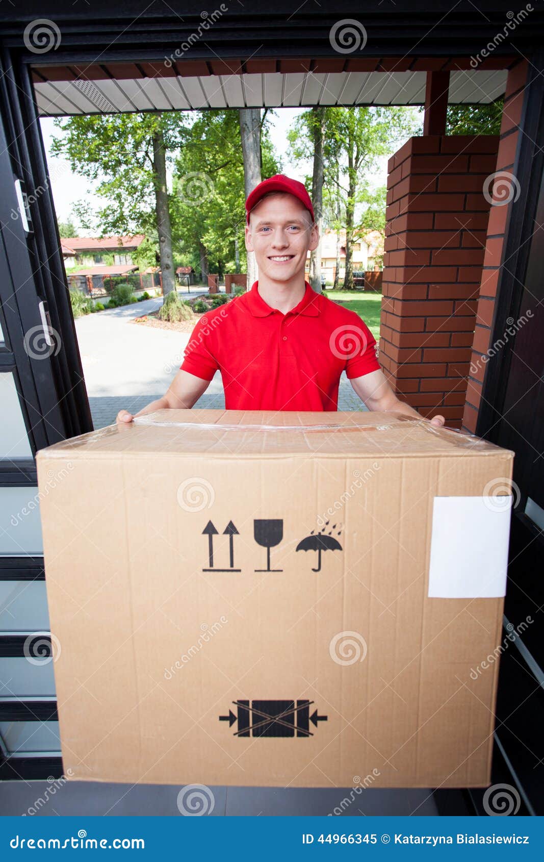 Delivery Guy Handing in Box Stock Image - Image of adult, occupation ...