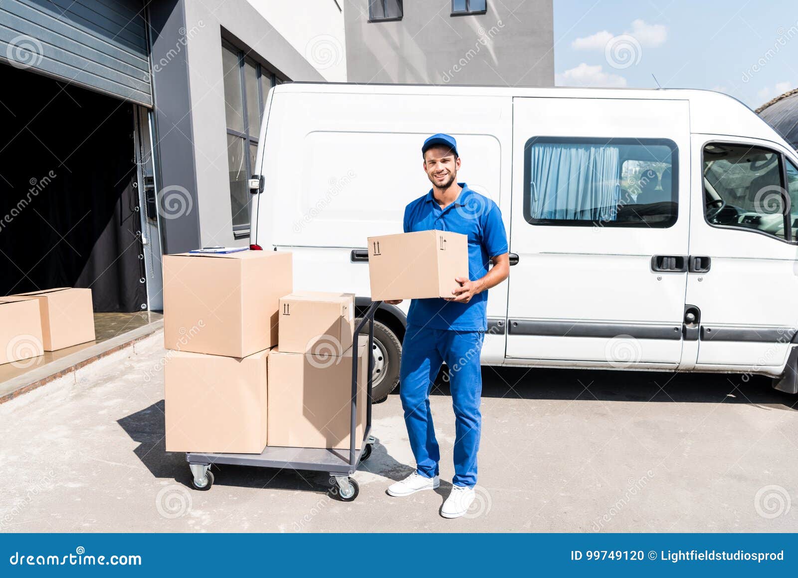 Delivery man with box stock photo. Image of freight, delivery - 99749120