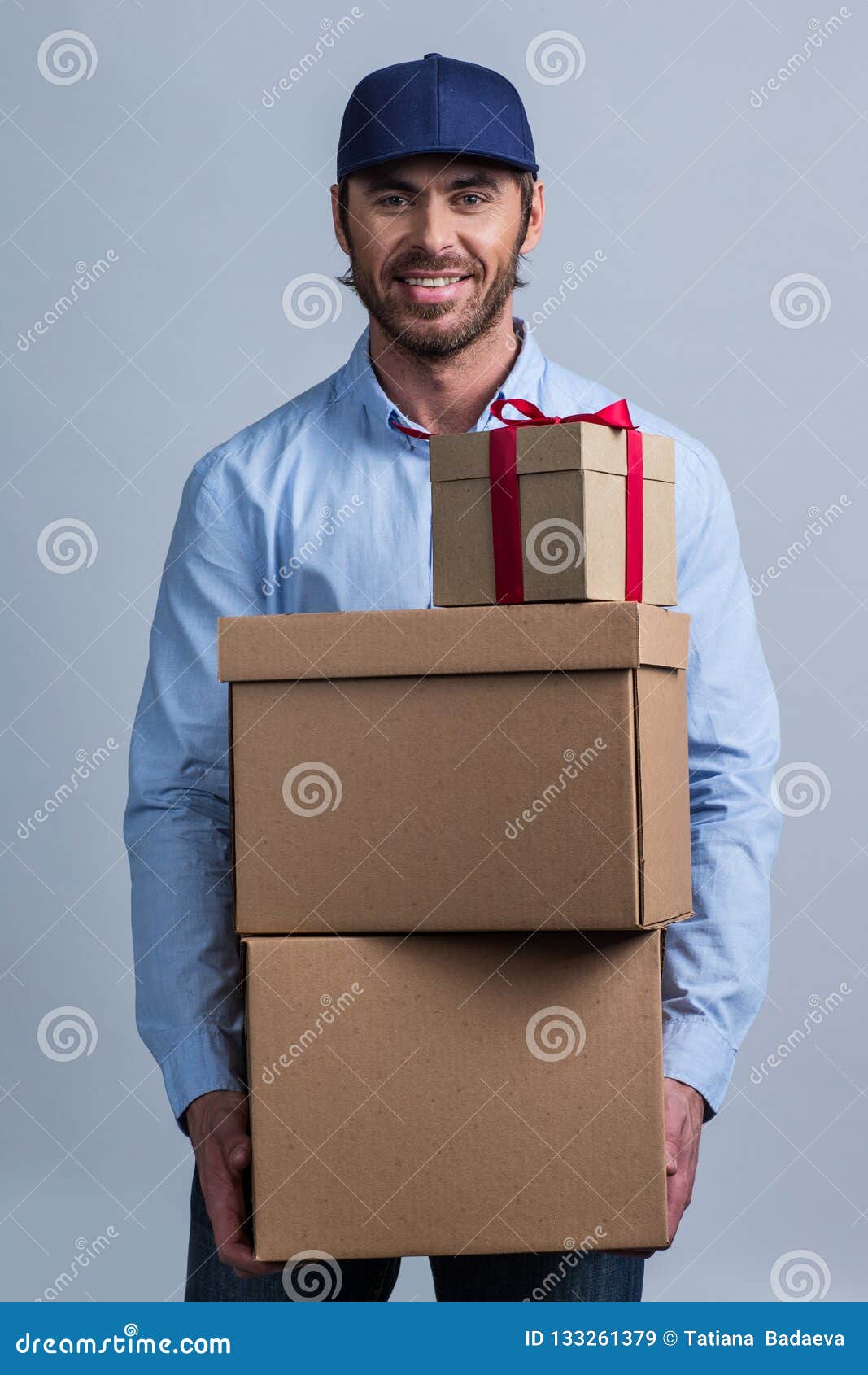 Delivery man with boxes stock image. Image of work, studio - 133261379