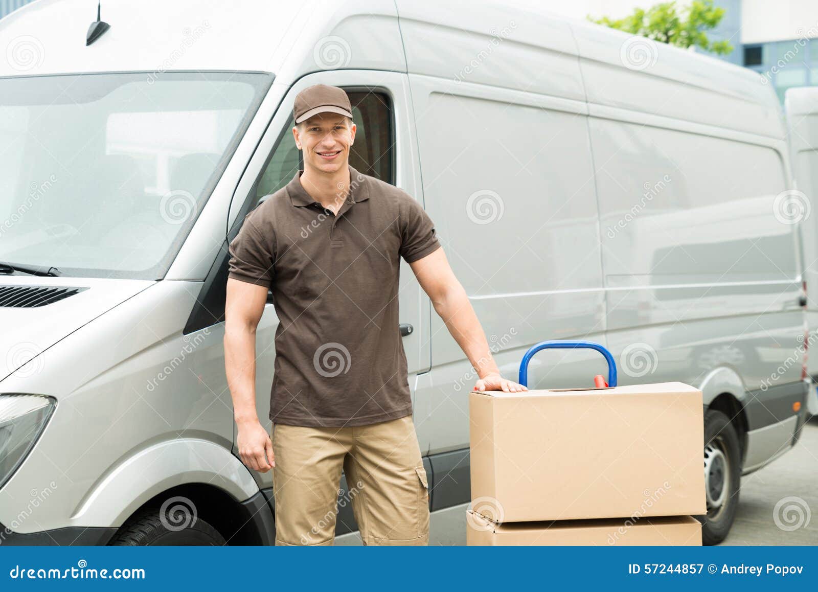 Delivery Man with Cardboard Boxes on Trolley Stock Image - Image of ...