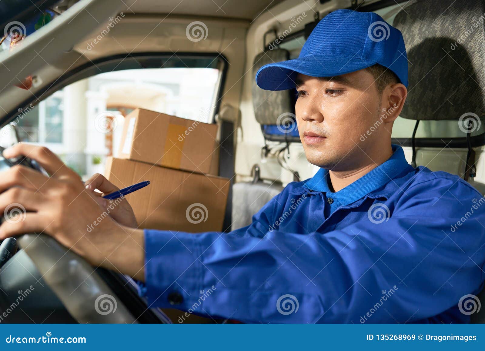 Delivery Man Checking Addresses Stock Image - Image of asian, signing ...