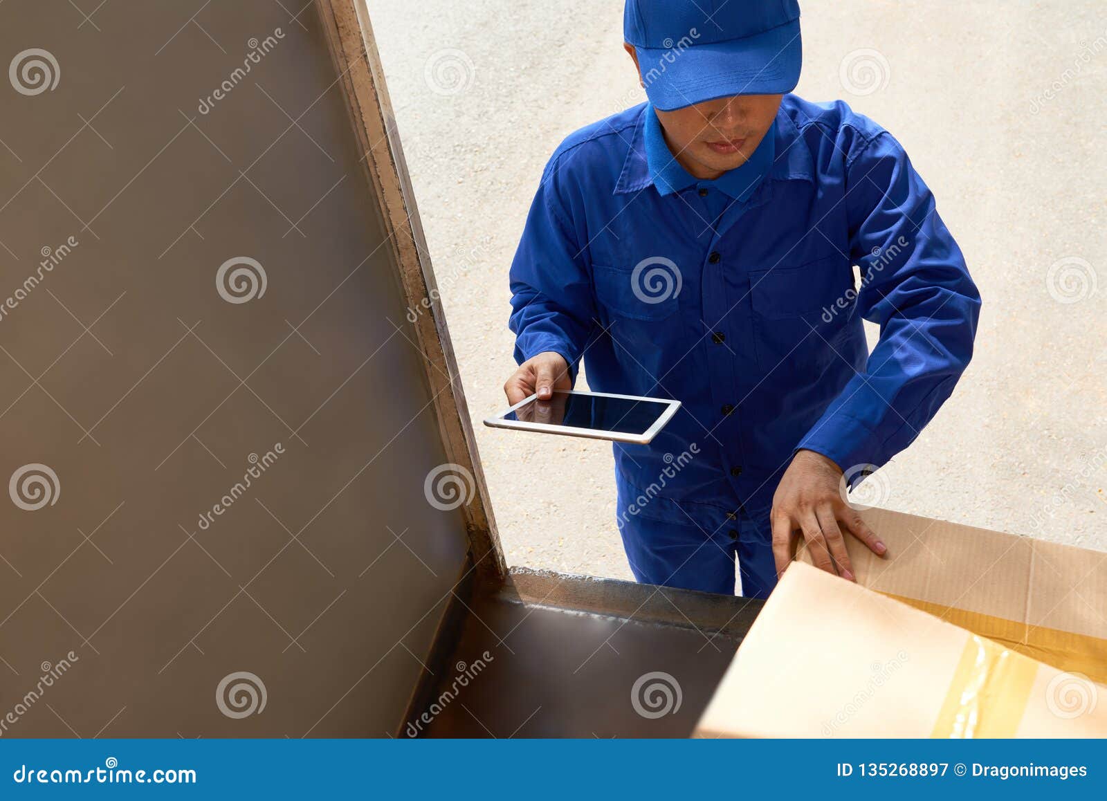 Delivery Man Checking Boxes Stock Image - Image of occupation, mailman ...