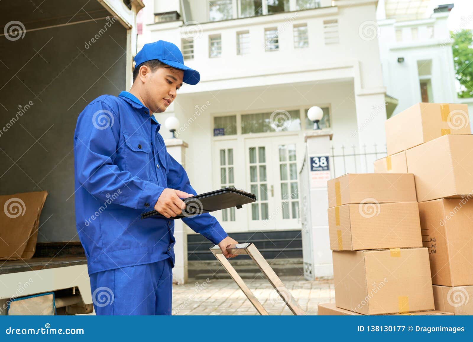 Delivery Man Checking Document Stock Image - Image of male, loading ...