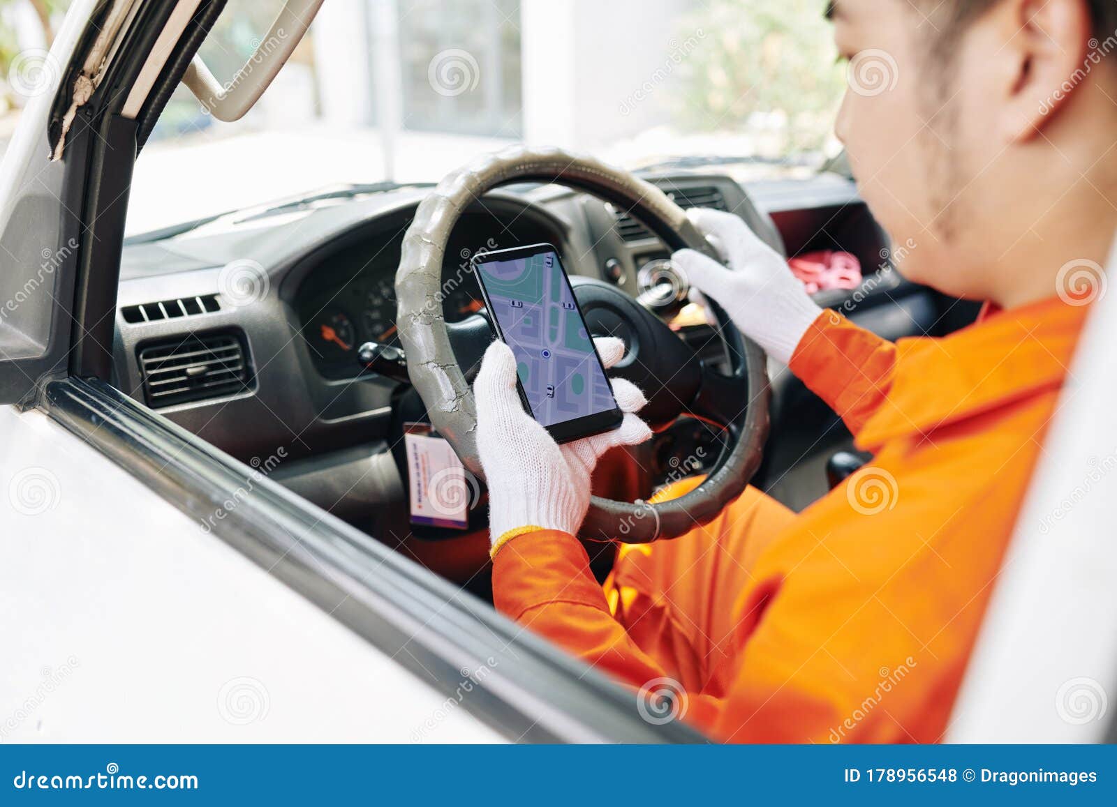 Delivery Man Checking Map on Smartphone Stock Photo - Image of service ...