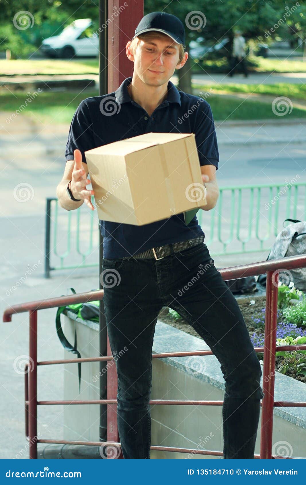 Delivery Man Delivering Package Box To Homeowner Stock Photo - Image of ...