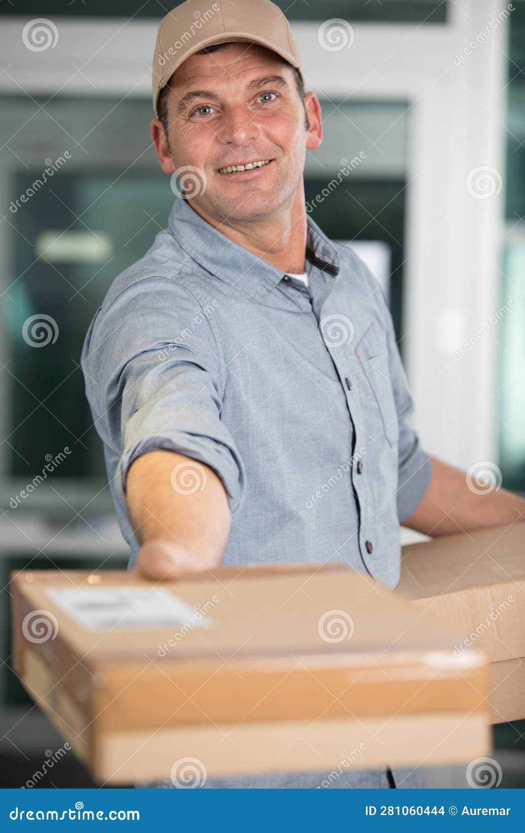 Delivery Man Delivering Package To Homeowner Stock Photo - Image of ...