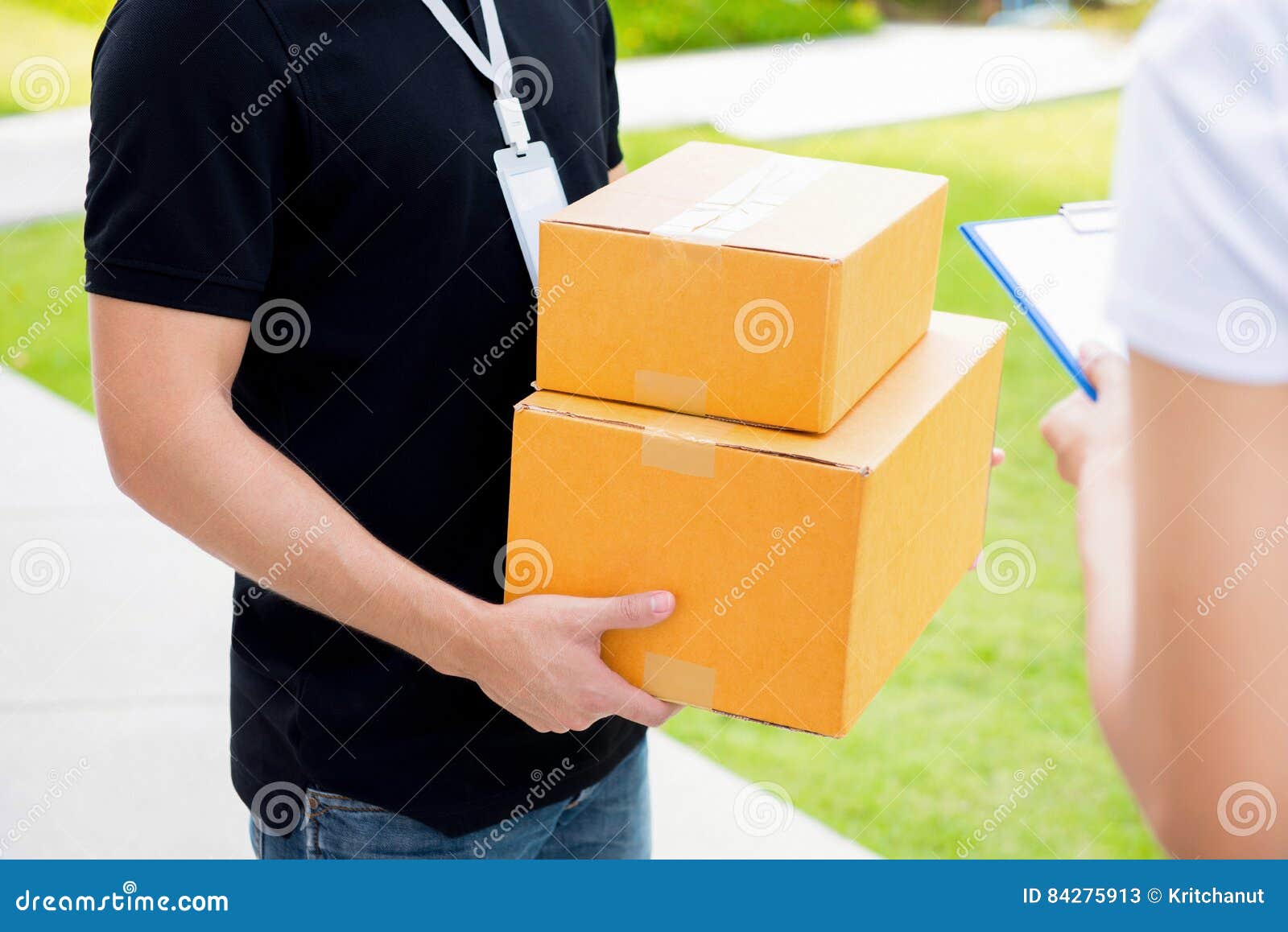 Delivery Man Delivering Packages To Recipient Stock Image - Image of ...