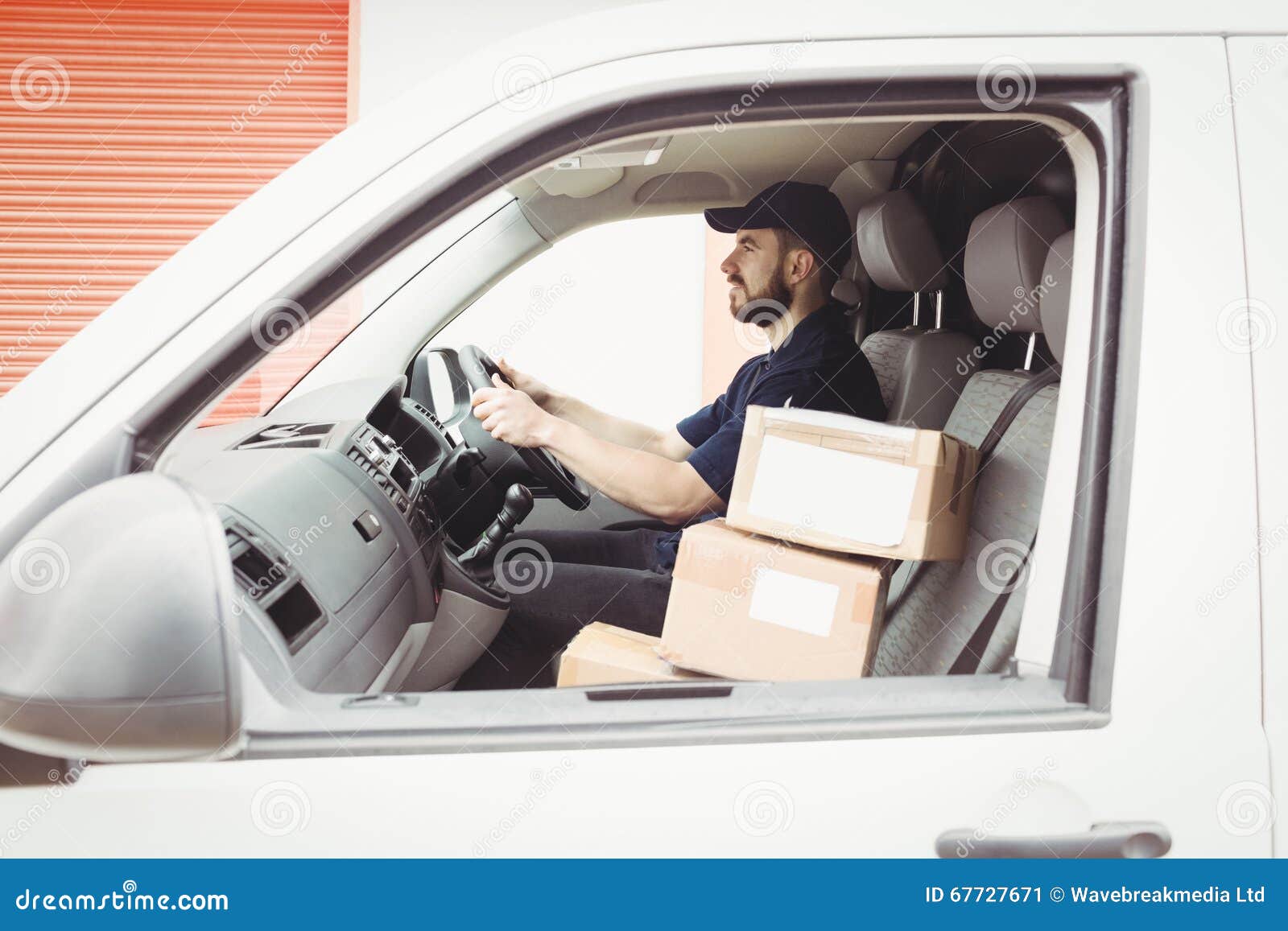 Delivery Man Driving His Van Stock Image - Image of confident, parcel ...