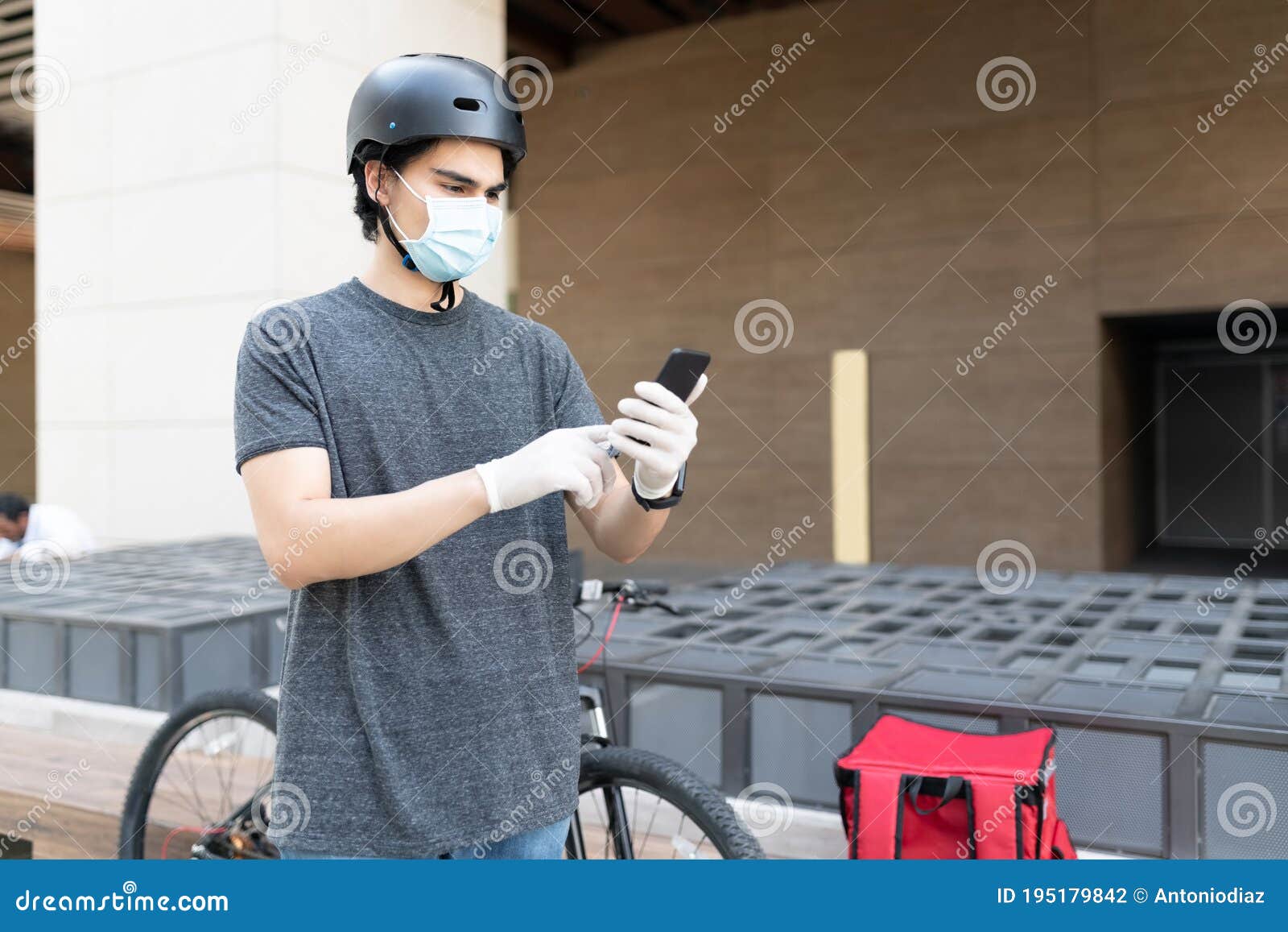 Delivery Man in Face Mask Using Mobile App Stock Photo - Image of latin ...