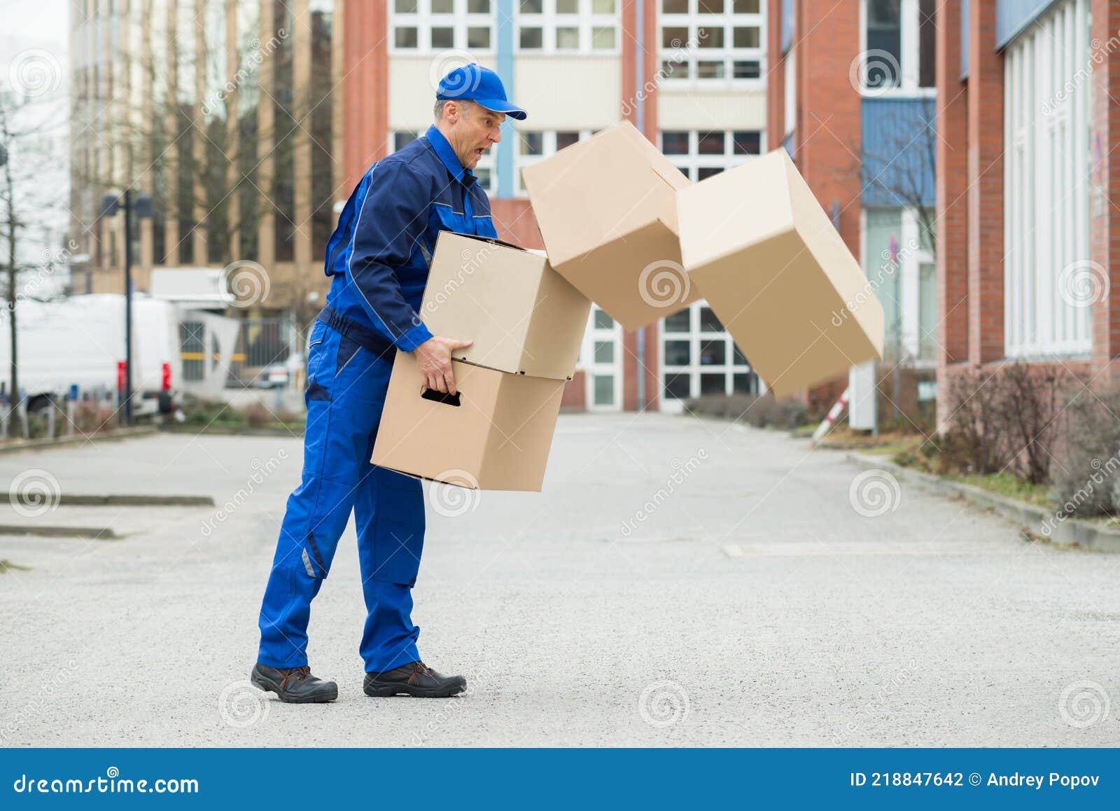 Delivery Man With Falling Boxes On Yellow Background Royalty-Free Stock ...