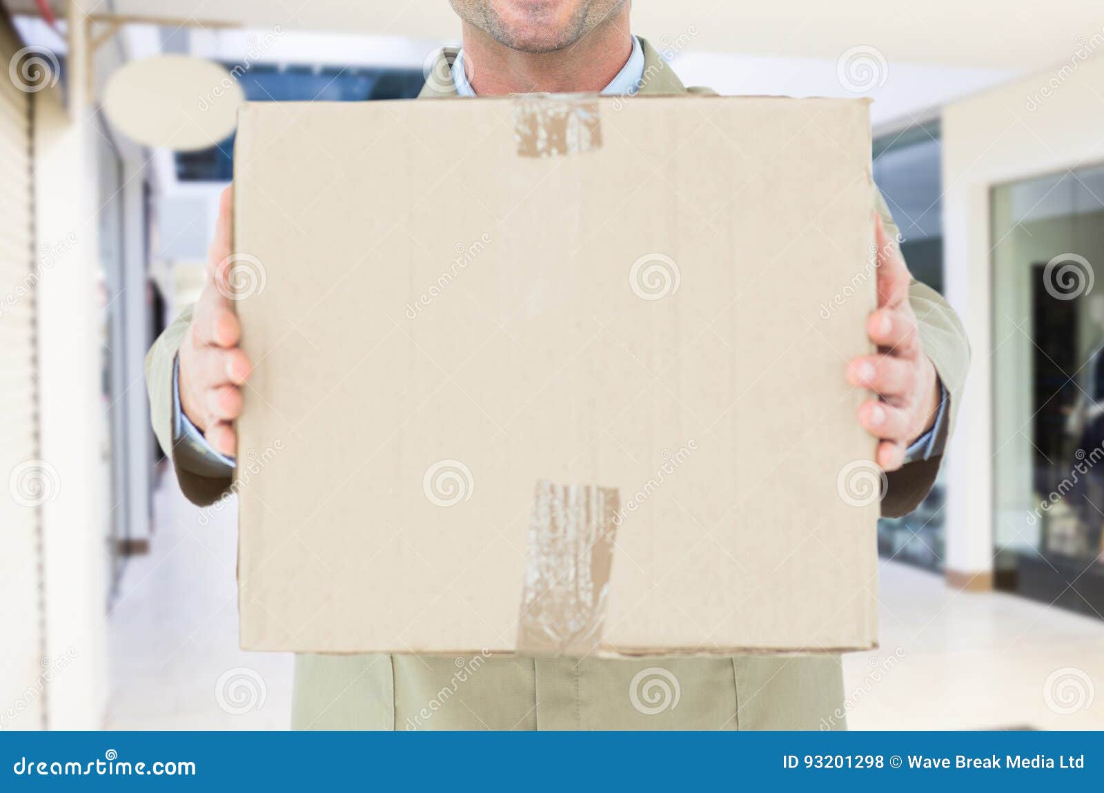 Delivery Man Giving His Box To Someone Stock Photo - Image of corridor ...