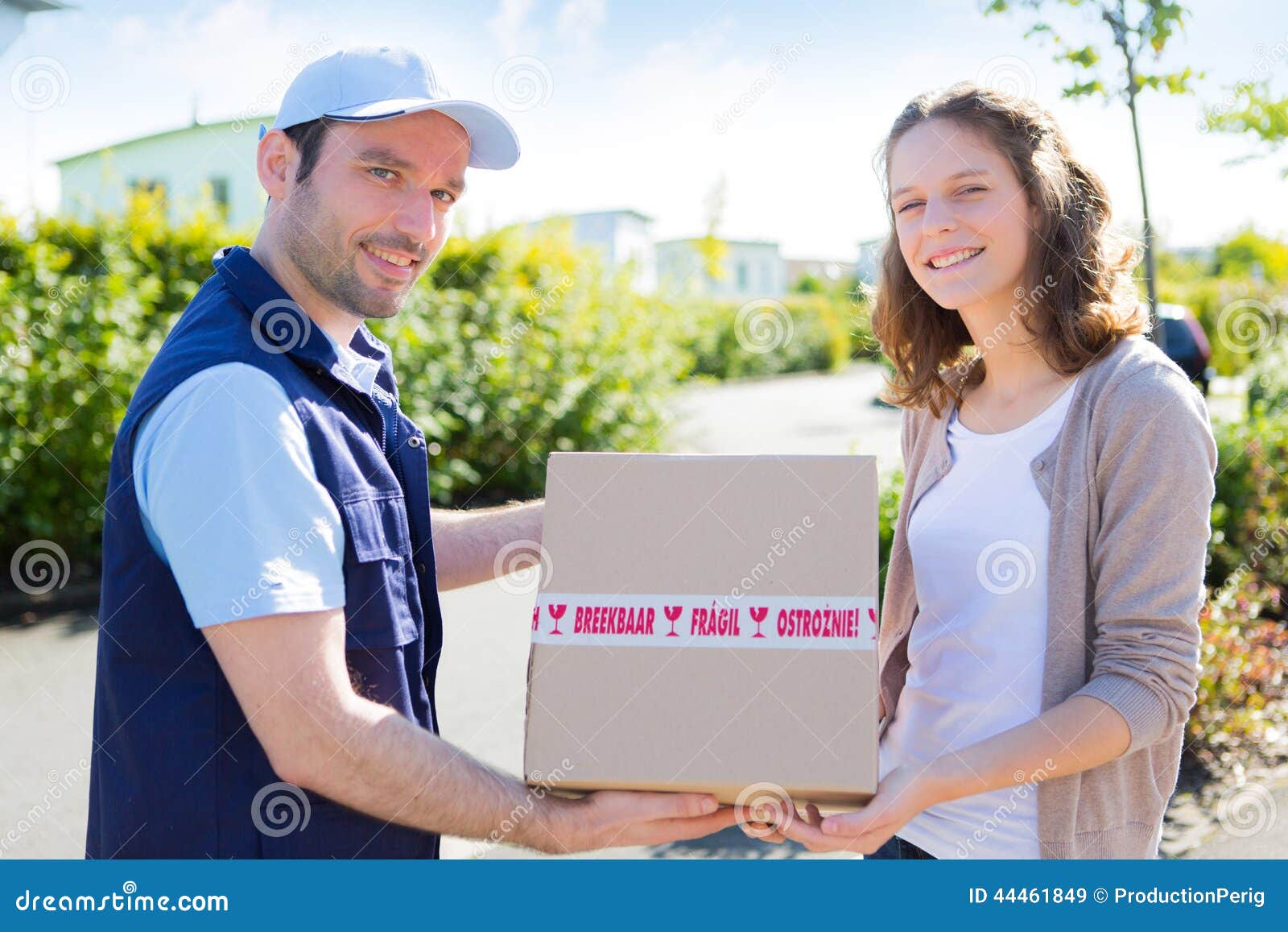 Delivery Man Handing Over a Parcel To Customer Stock Image - Image of ...