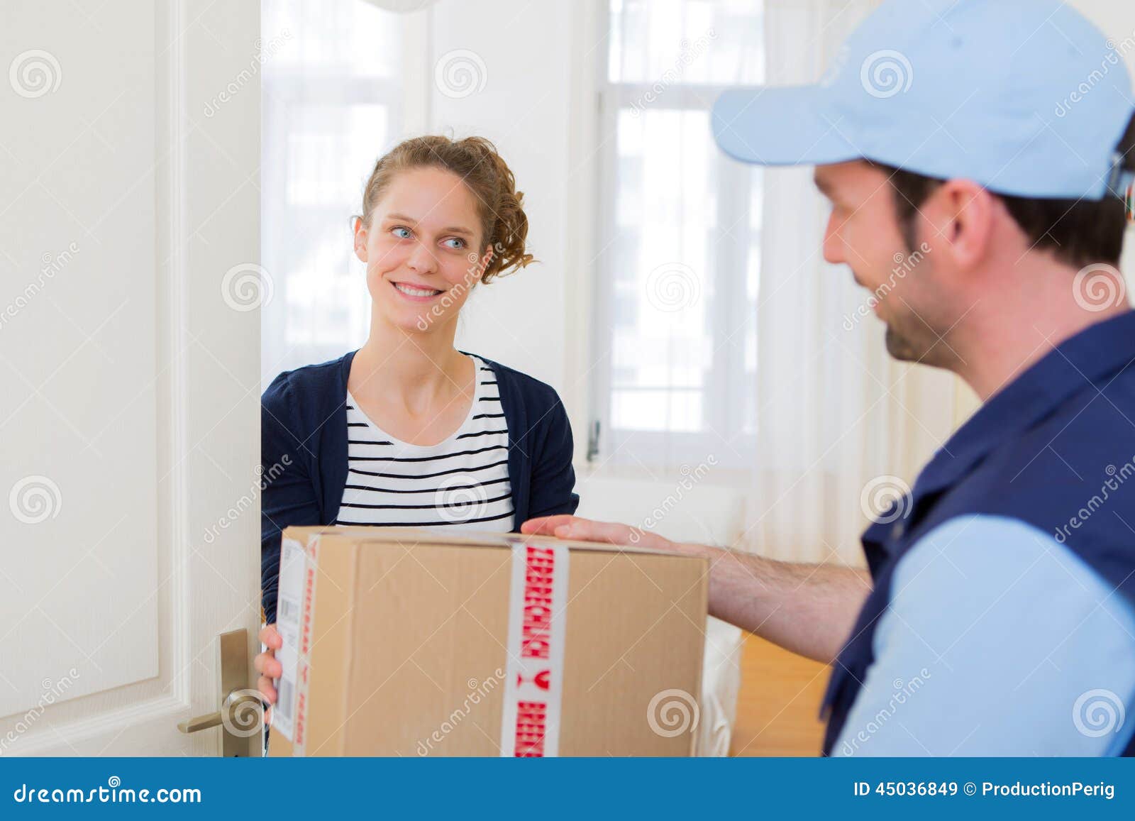 Delivery Man Handing Over a Parcel To Customer Stock Image - Image of ...