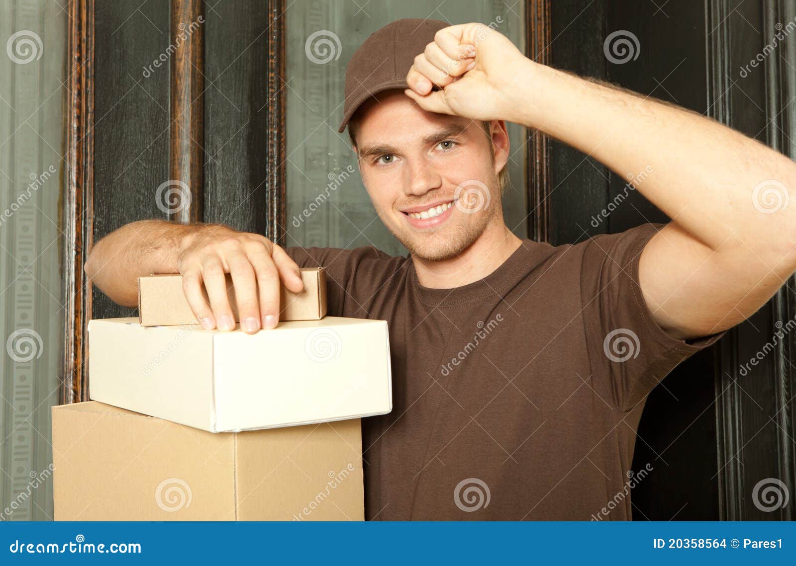 Delivery man with his cap stock photo. Image of hand - 20358564