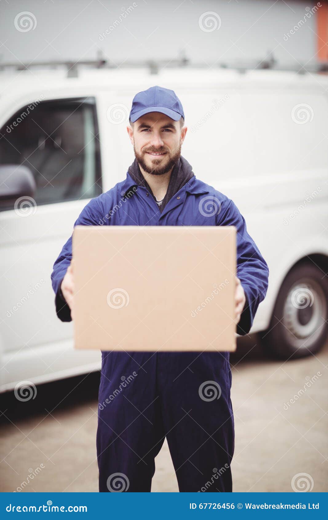 Delivery man holding box stock photo. Image of crate - 67726456