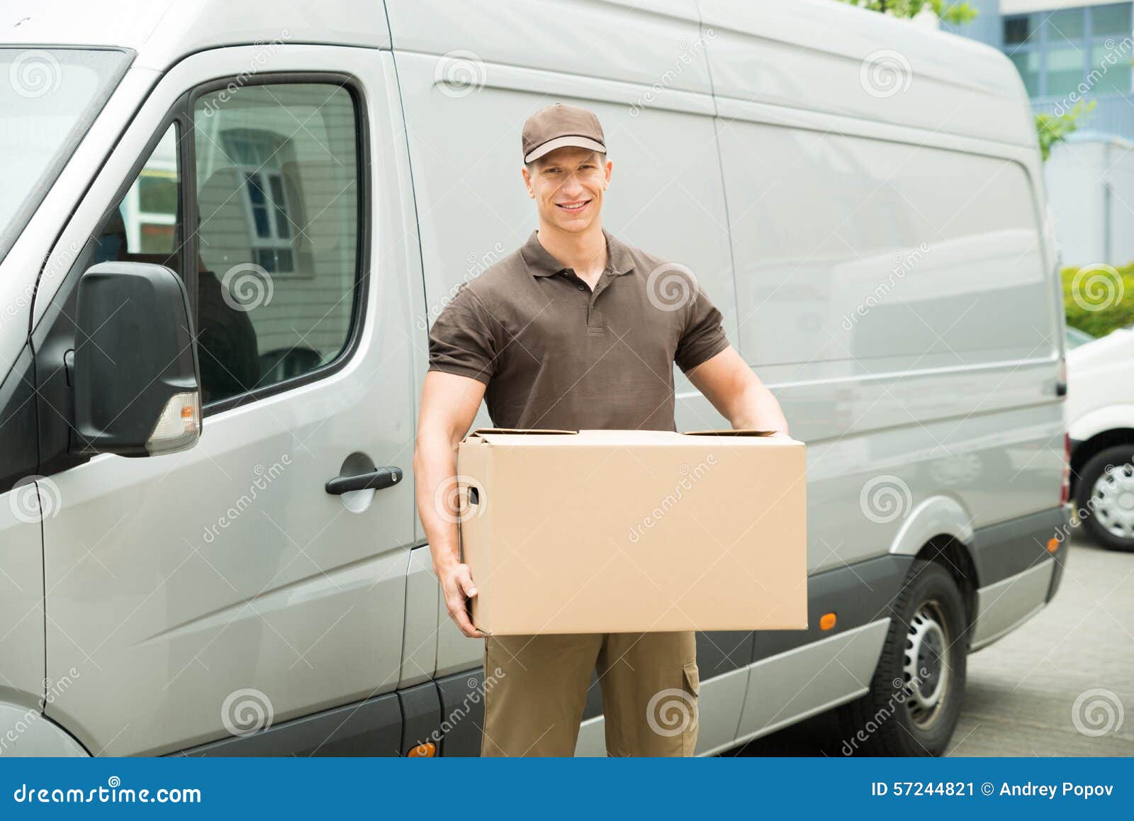 Delivery Man Holding Box stock image. Image of cardboard - 57244821