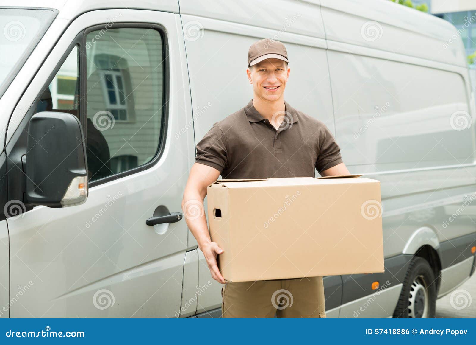 Delivery Man Holding Box stock photo. Image of person - 57418886