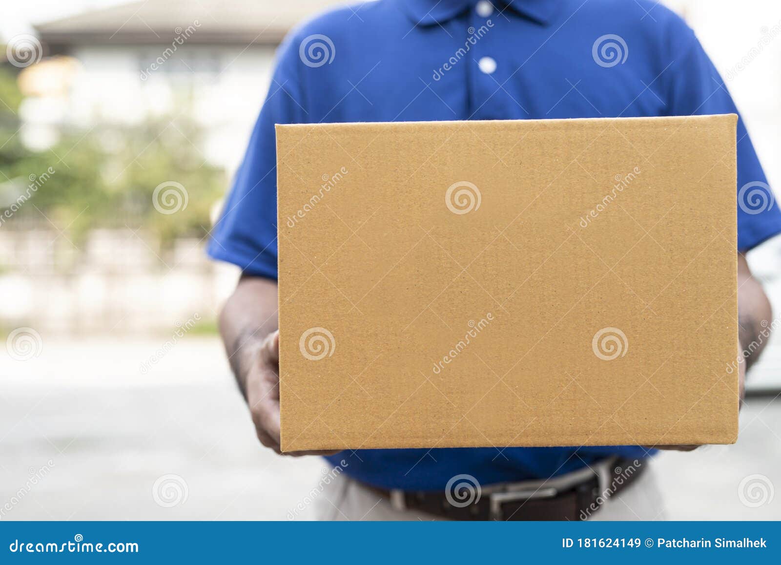 A Delivery Man Holding Boxes of Paper Containers. Stock Image - Image ...